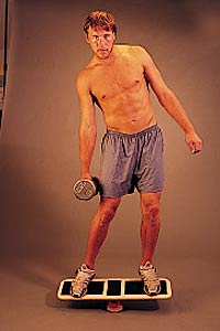 5. Dumbbell Side Bends on Balance Board